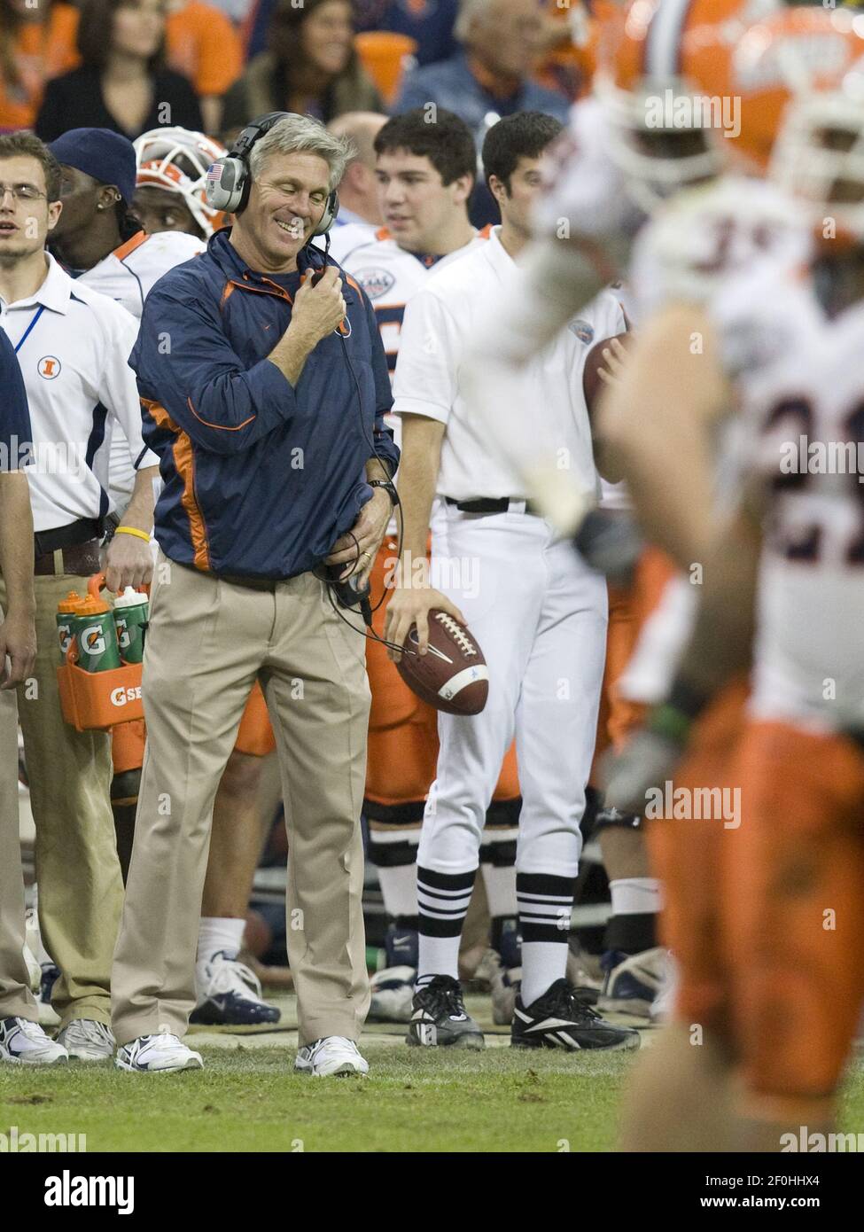 Illinois head coach Ron Zook smiles on the sidelines as time winds down ...