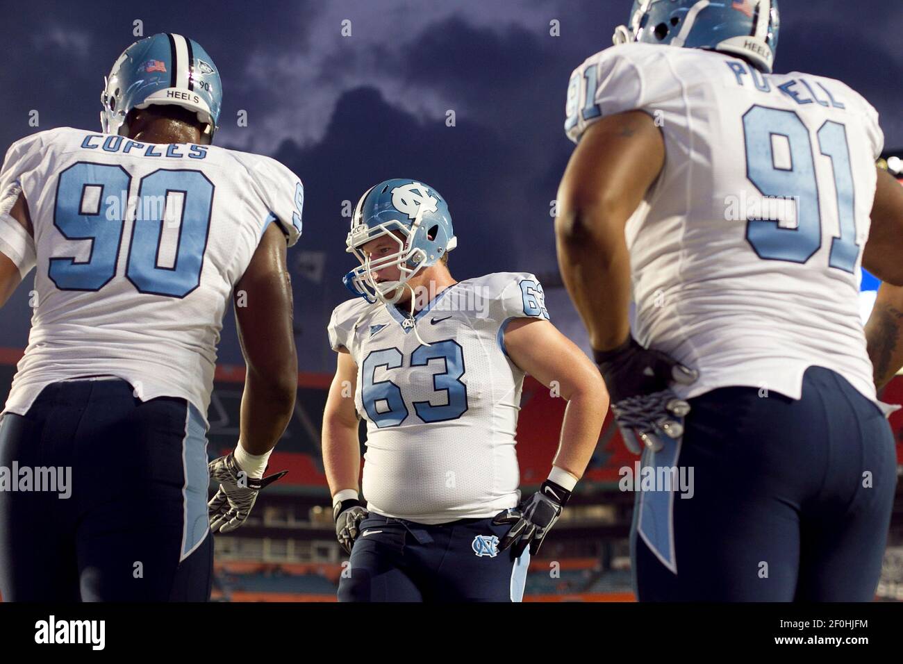 North Carolina's Quinton Coples (90), Peyton Jenest (63) and Tydreke ...