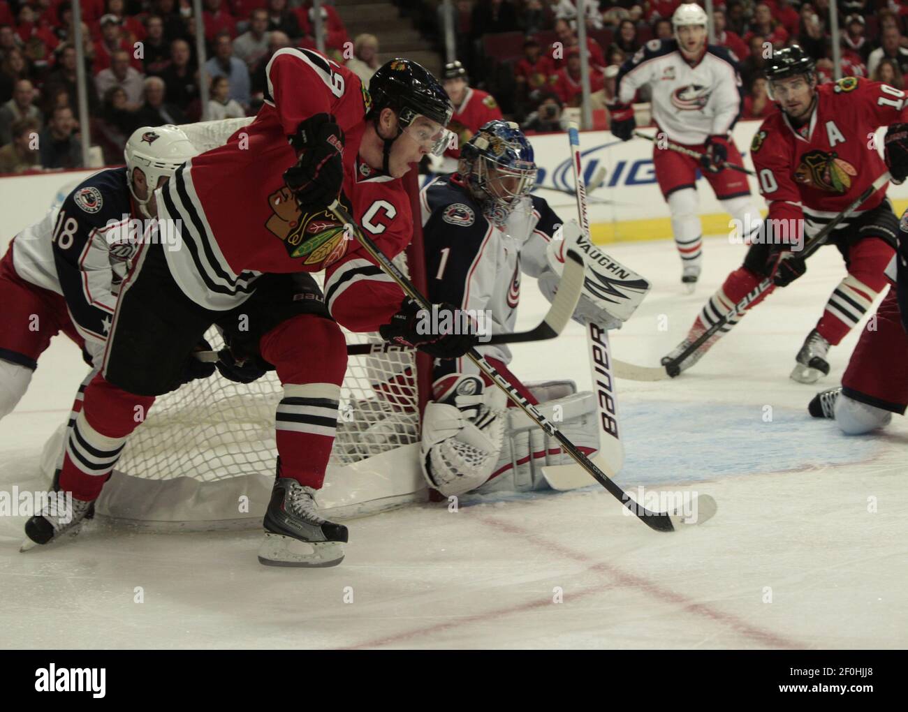 Chicago Blackhawks center Jonathan Toews (19) passes the puck to ...