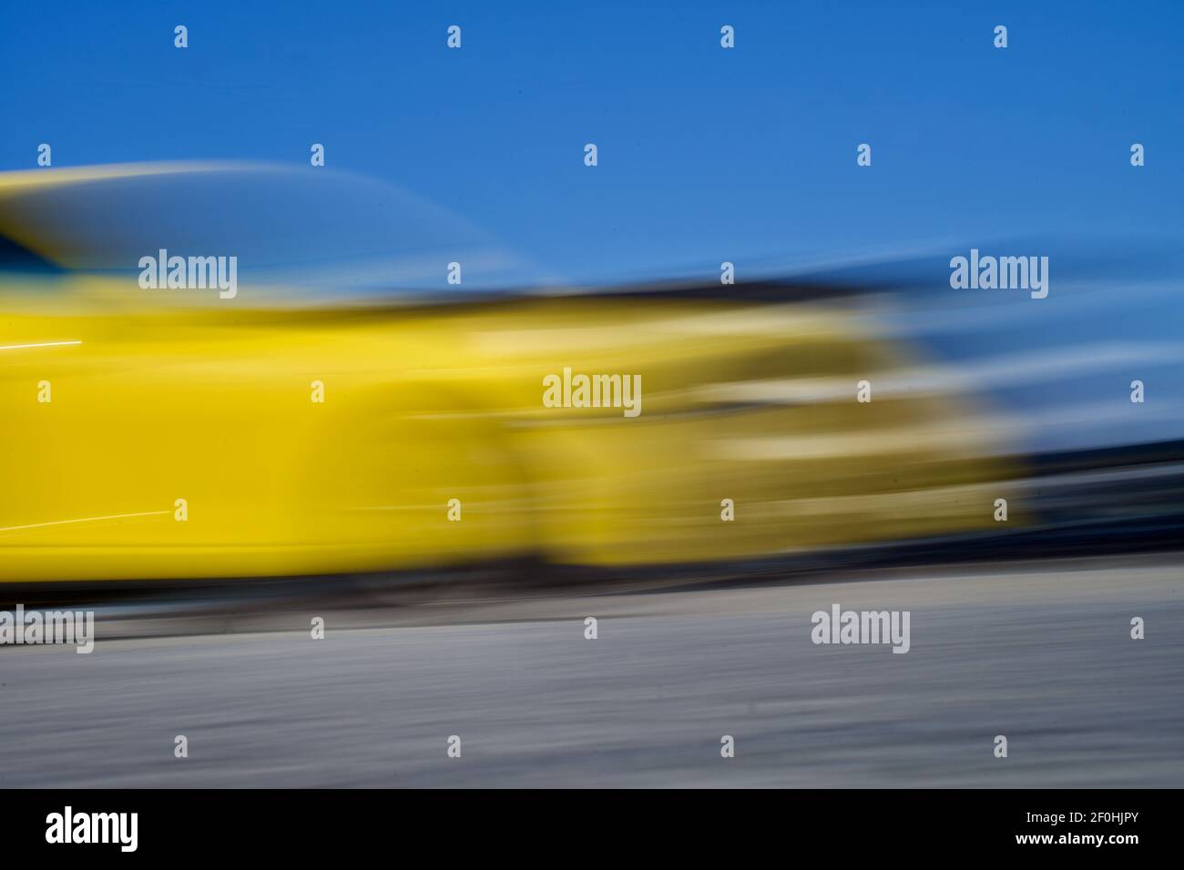 Yellow Porsche 911 in front of blue sky Stock Photo - Alamy