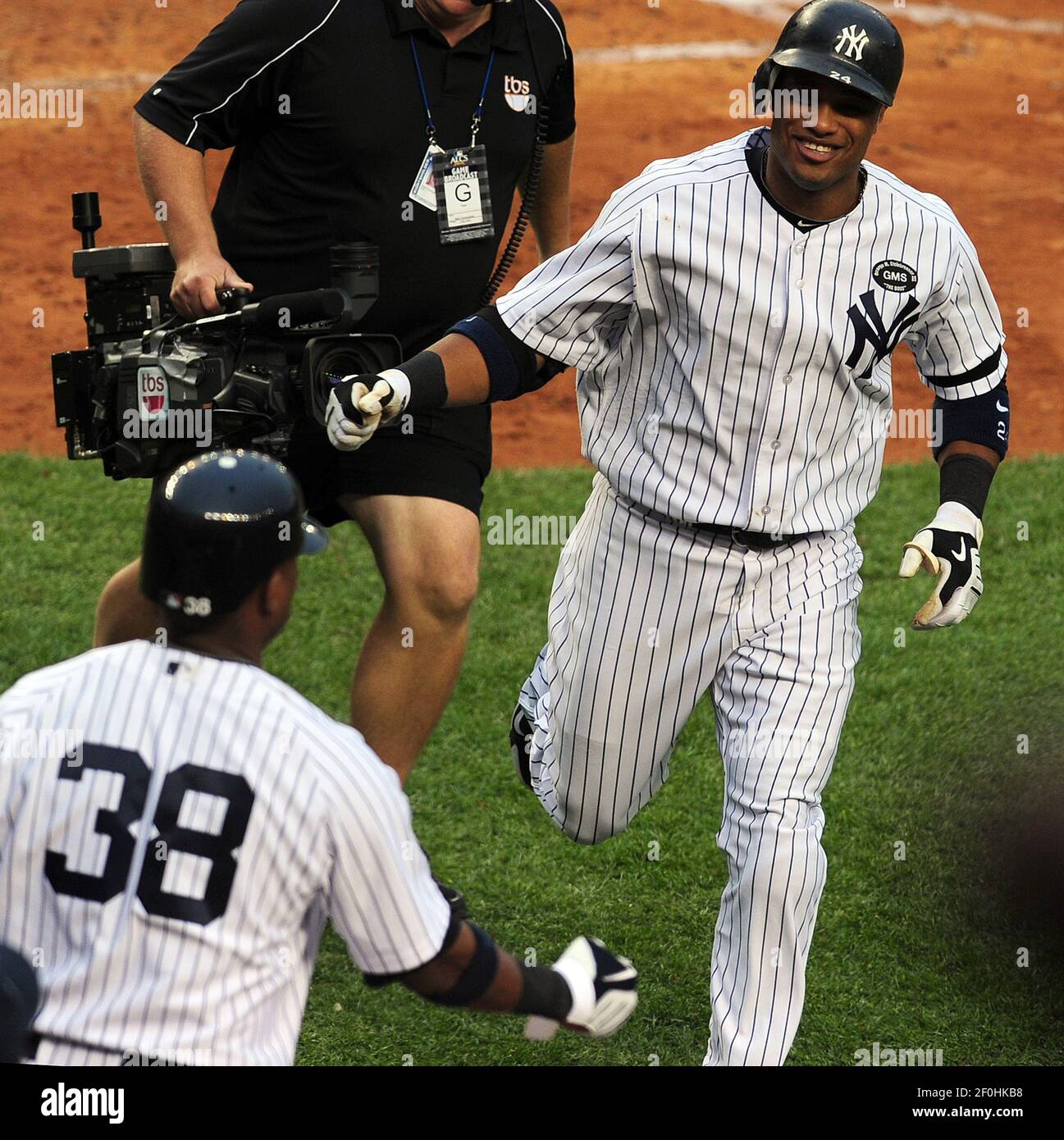 New York Yankees Robinson Cano rounds the bases after hitting a solo home run against the Texas ...