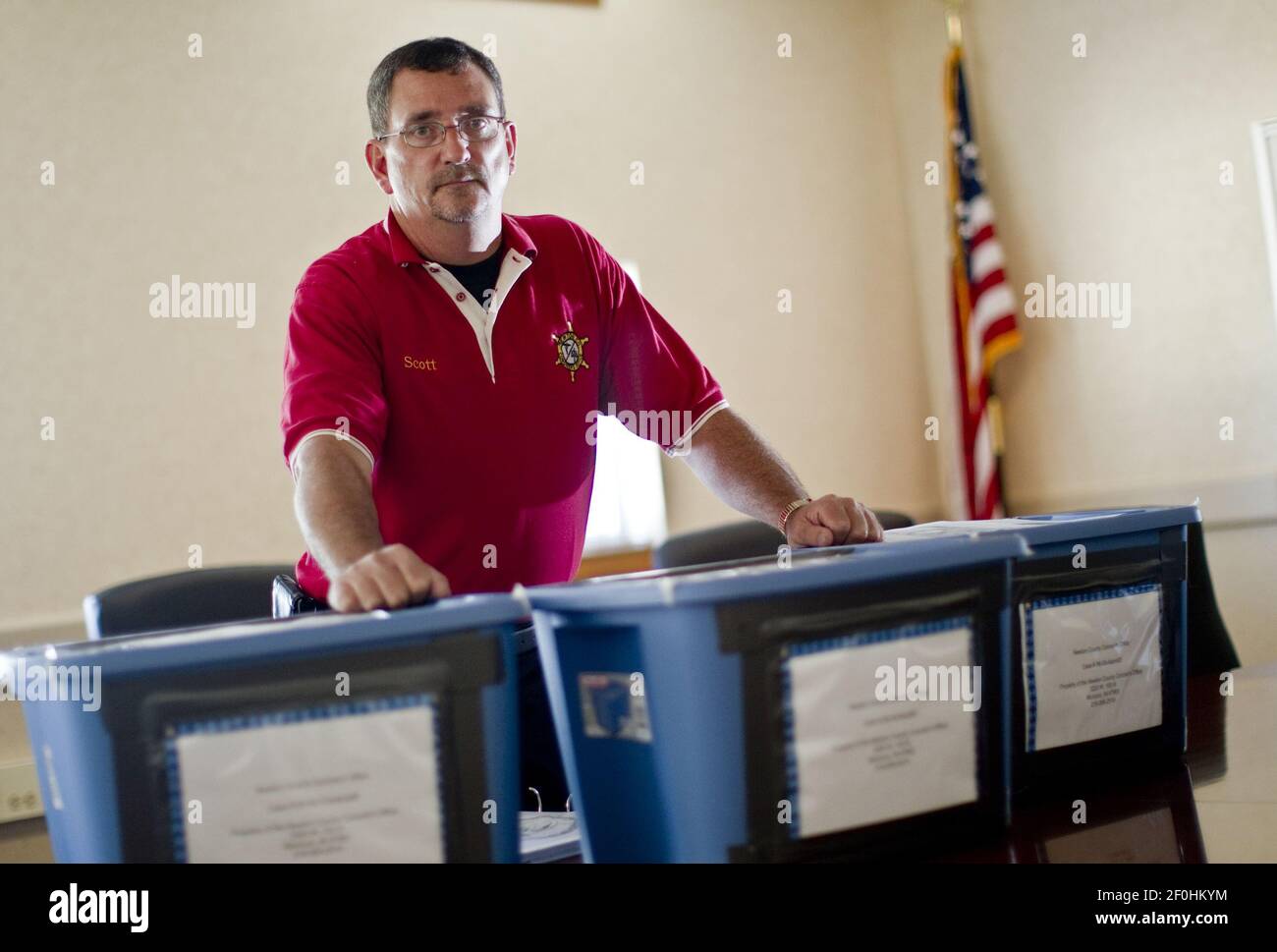 Scott McCord, the coroner of Newton County Indiana, shows boxes holding ...
