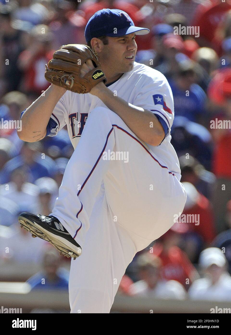 Texas Rangers starting pitcher Colby Lewis throws a pitch in the first ...
