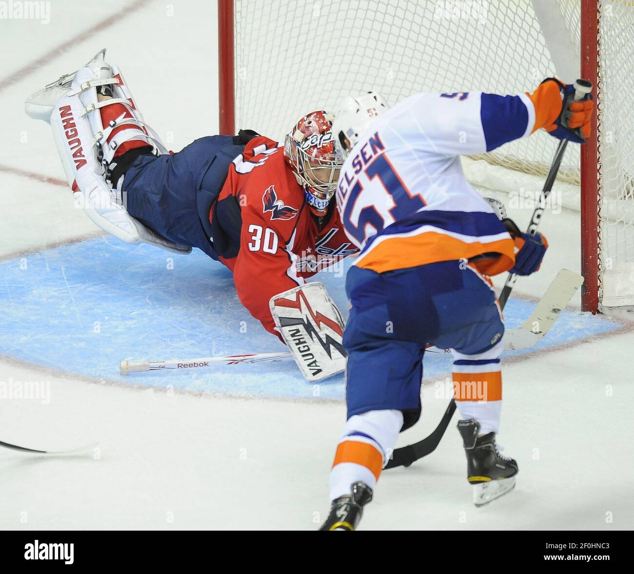 Washington Capitals goalie Michal Neuvirth (30) dives across the crease ...
