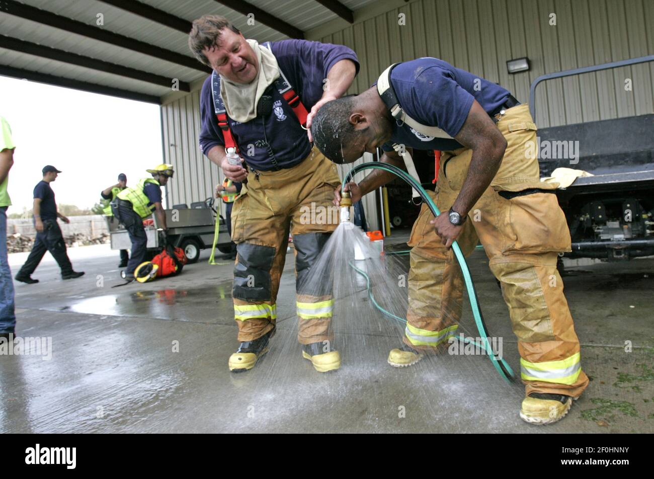 Fire Capt. Ward Palmer, left, and firefighter Antonio Smith of the ...