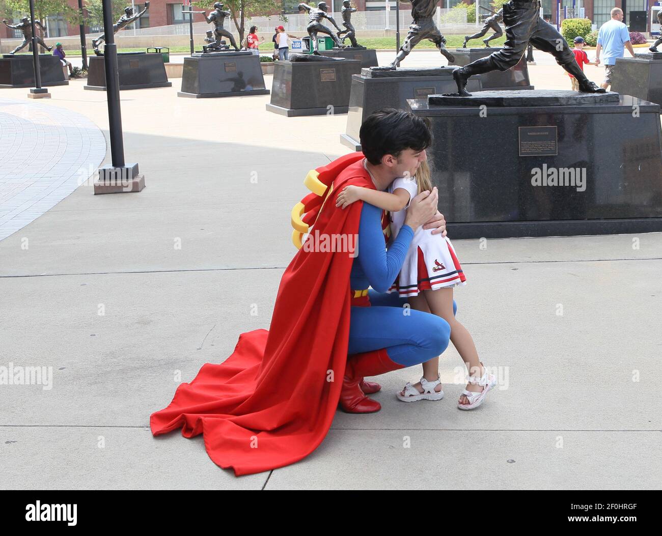 Street performer Charlee Chartrand, 23, left, gets a hug from Anna ...