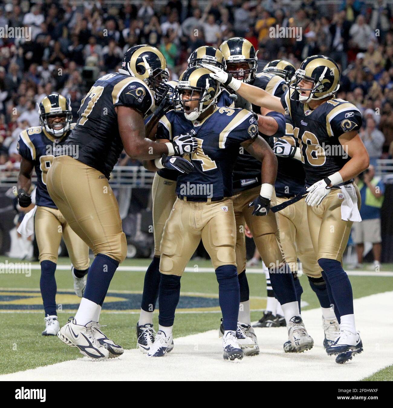 St. Louis Rams Kenneth Darby, center, is surrounded by his teammates ...