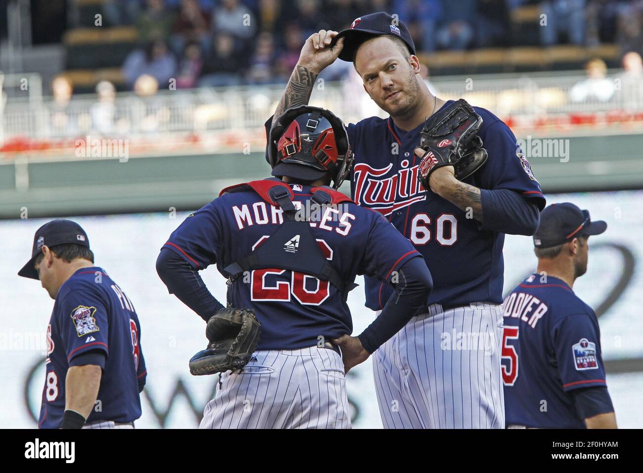 Minnesota Twins pitcher Jon Rauch (60) and catcher Jose Morales talk ...