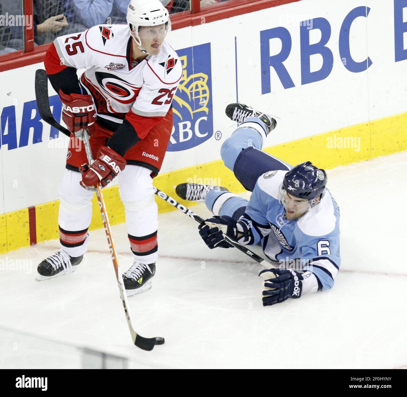 The Carolina Hurricanes' Joni Pitkanen (25) works the puck against the ...
