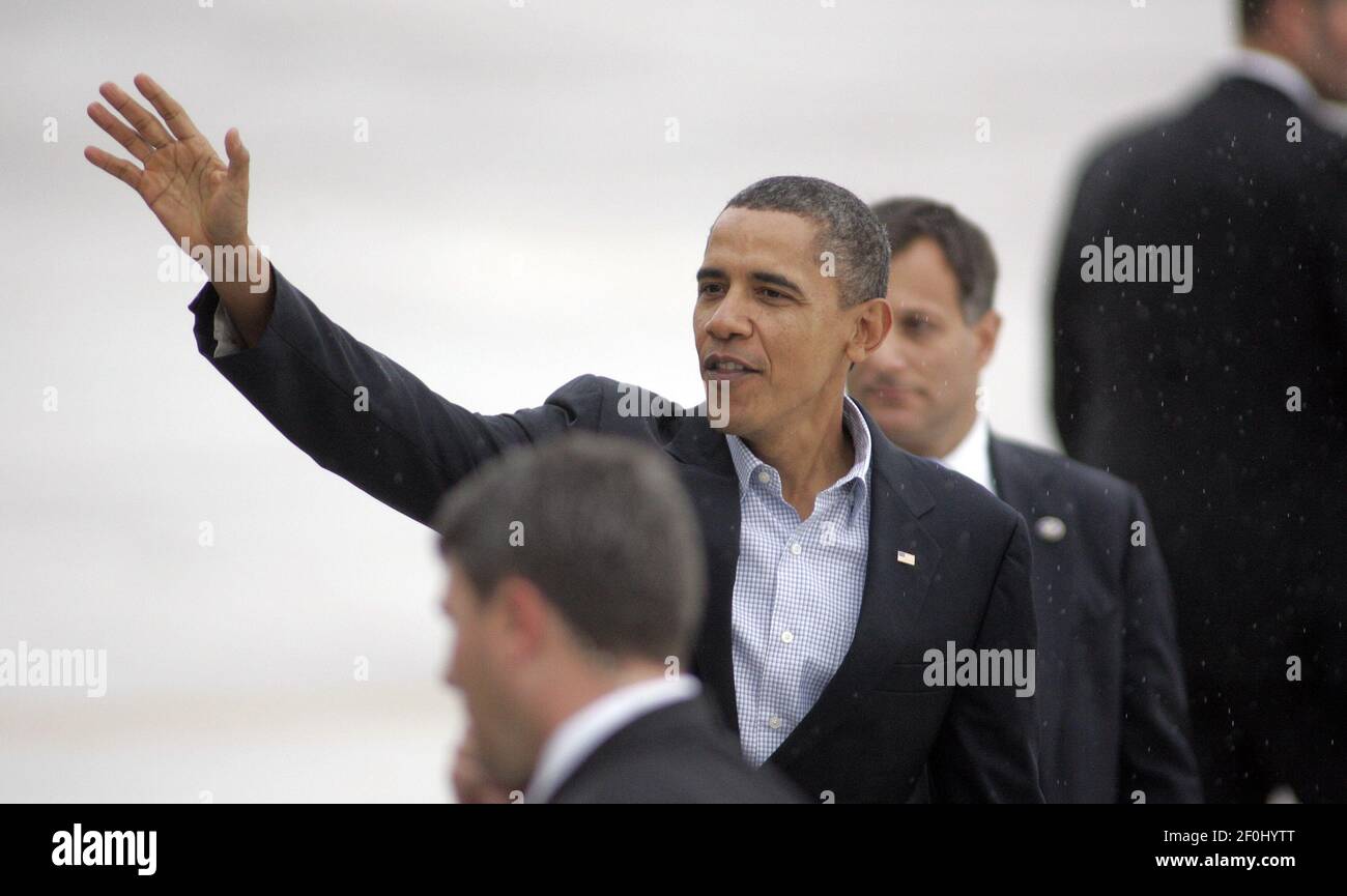 President Barack Obama waves to the crowd after arriving at the ...