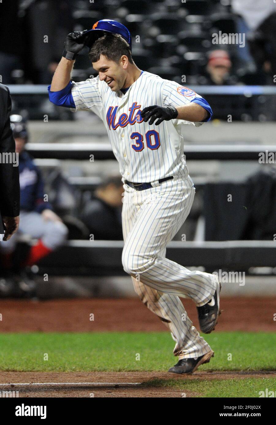 The New York Mets' Josh Thole prepares to cross home plate after ...