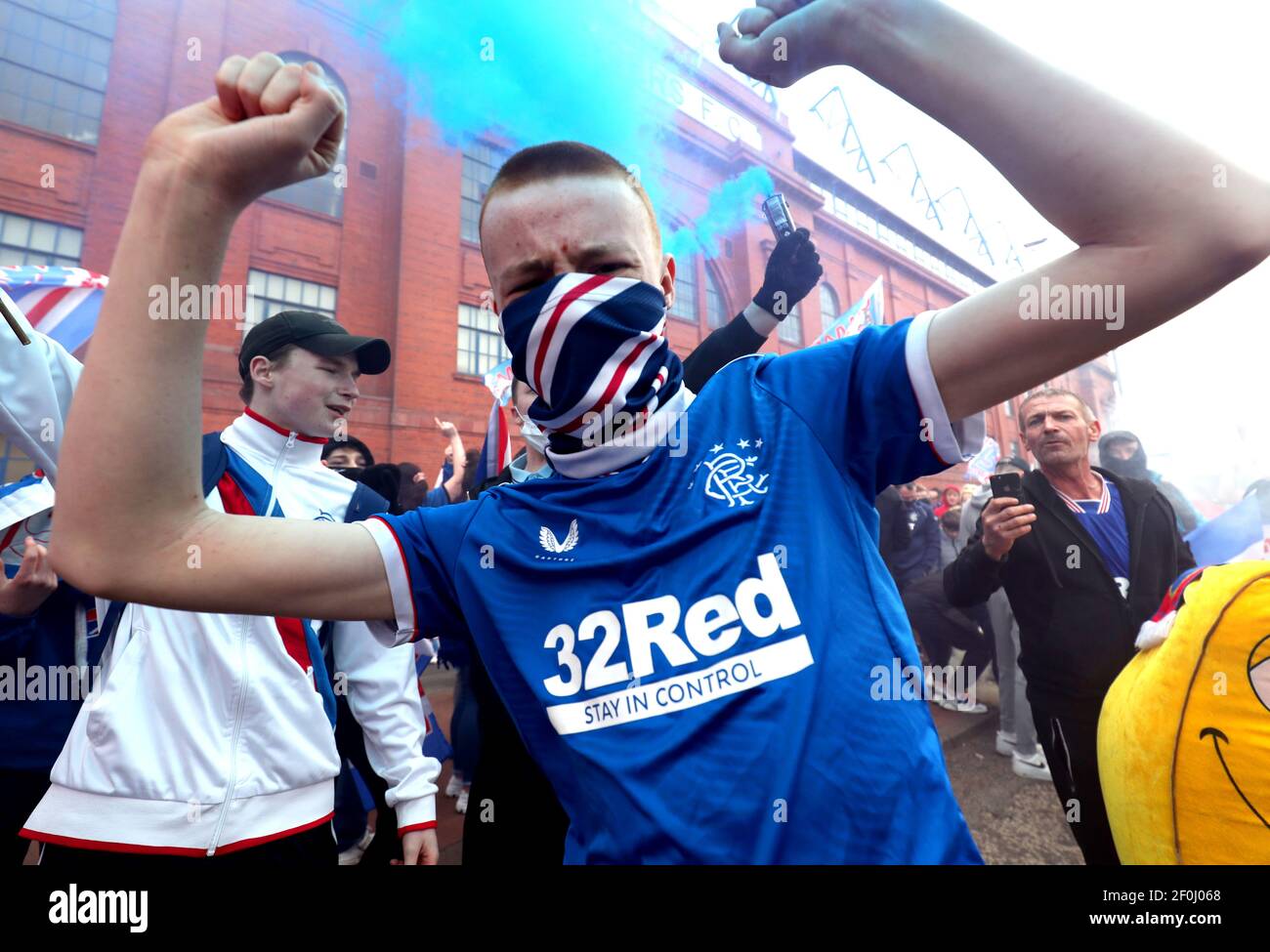 Rangers fans celebrate outside of the Ibrox Stadium after Rangers win ...