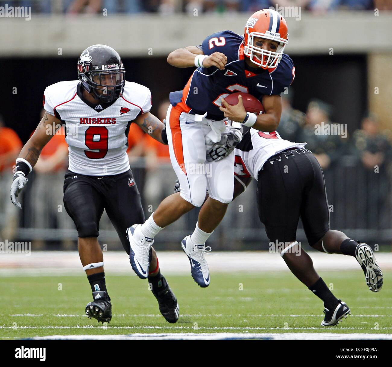 Illinois quarterback Nathan Scheelhaase leaps on a run against Northern ...