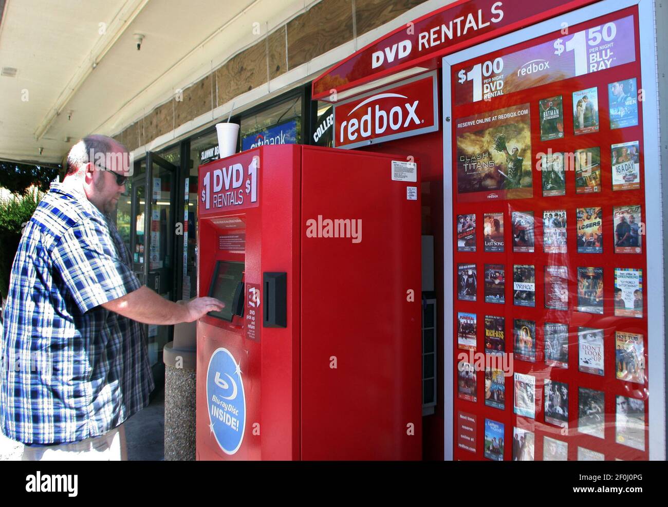 Matt Foster of Danville, California, makes a selection at the Red Box ...