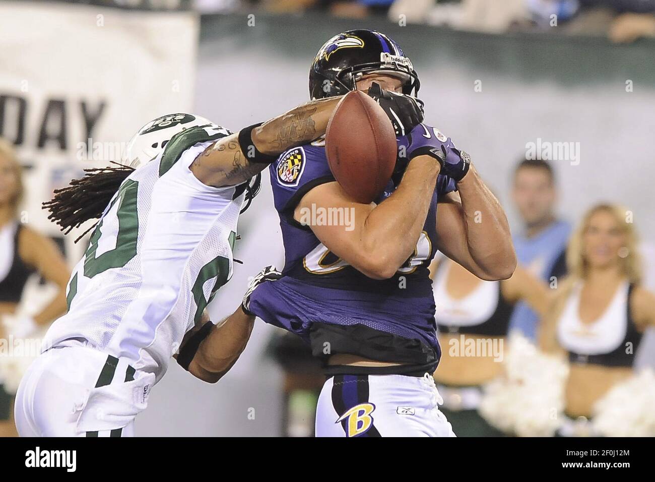 New York Jets' Kyle Wilson breaks up a pass intended for Baltimore ...
