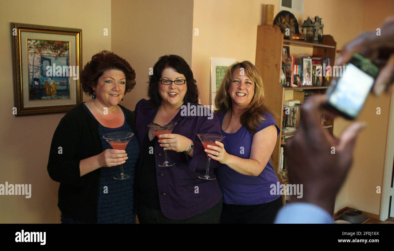 Jen Jaciw, left, Chrystal Bougon, center, and Julie Asiutor pose for a ...