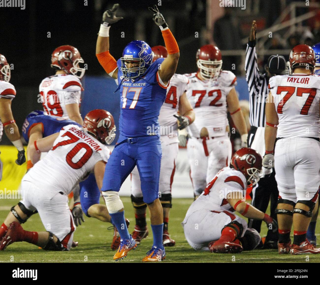 Boise State safety Winston Venable, middle, celebrates amid the Broncos ...