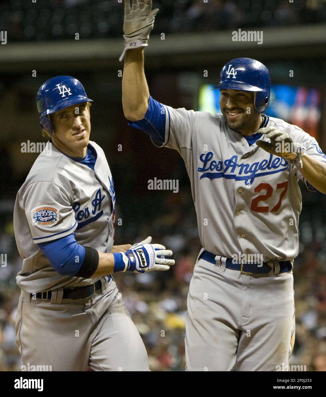 Jay Gibbons (31) of the Los Angeles Dodgers, left, is congratulated by ...