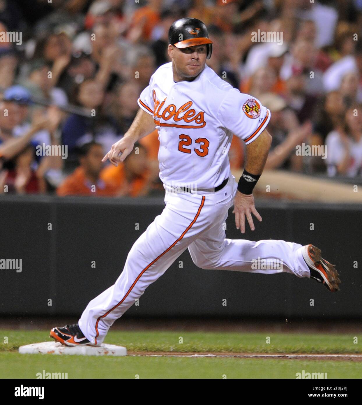 Baltimore Orioles' Ty Wigginton scores on a double by Matt Wieters in ...
