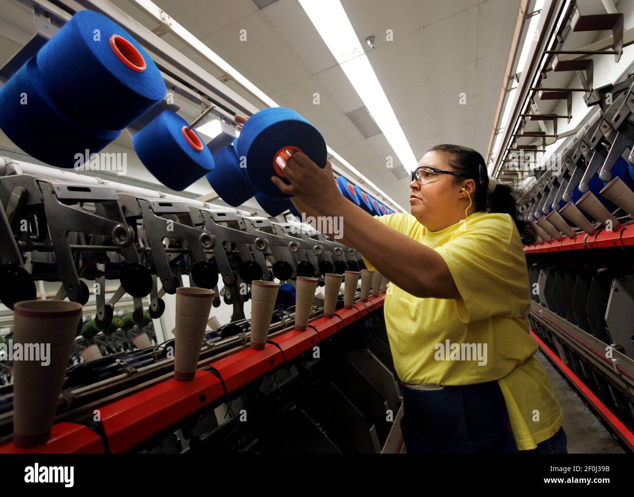 Bonnie Johnson, 43, an employee of 24 years, works in the Twisting ...