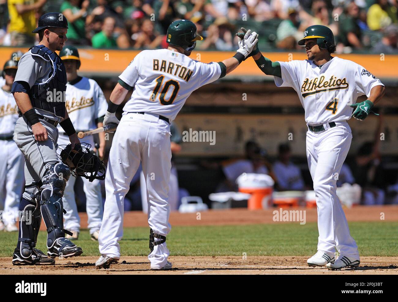 Oakland Athletics Coco Crisp (4) is congratulated by teammate Daric ...
