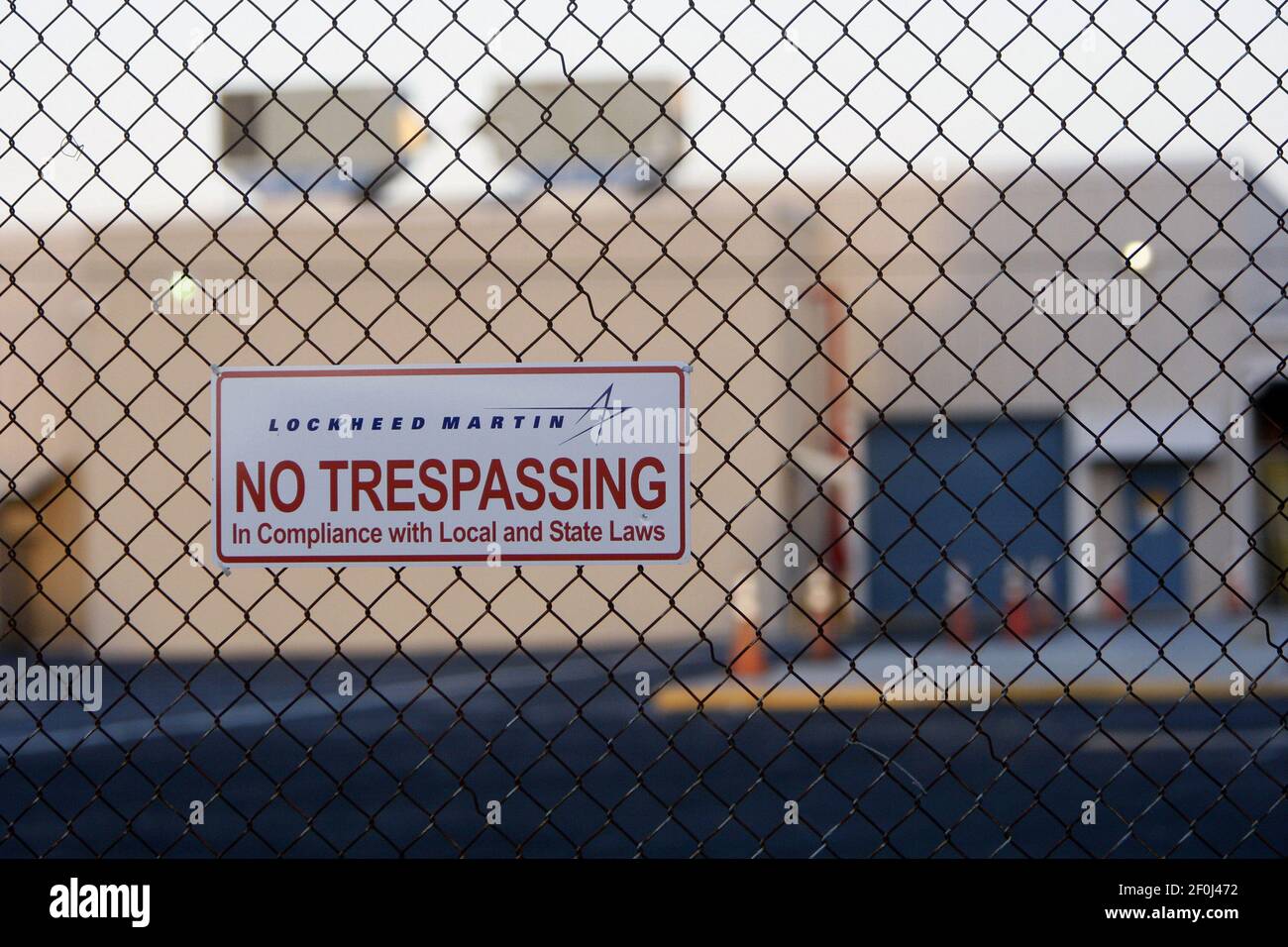 A no trespassing sign hangs on the fence surrounding the former ...