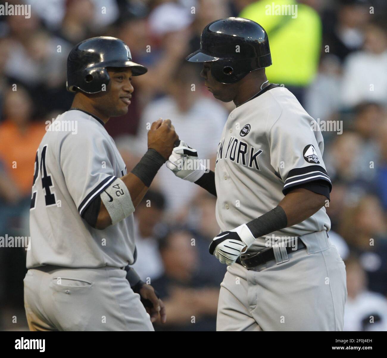 New York Yankees second baseman Robinson Cano, left, congratulates ...