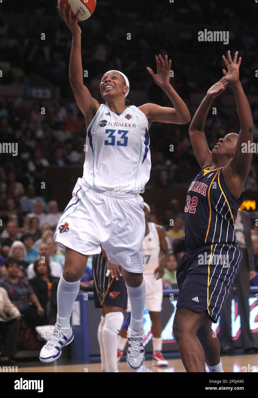 New York Liberty's Plenette Pierson (33) goes to the basket past ...