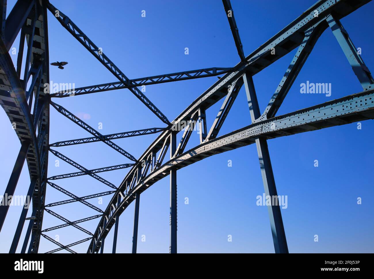 Low angle view on isolated symmetrical industrial steel bridge deck ...