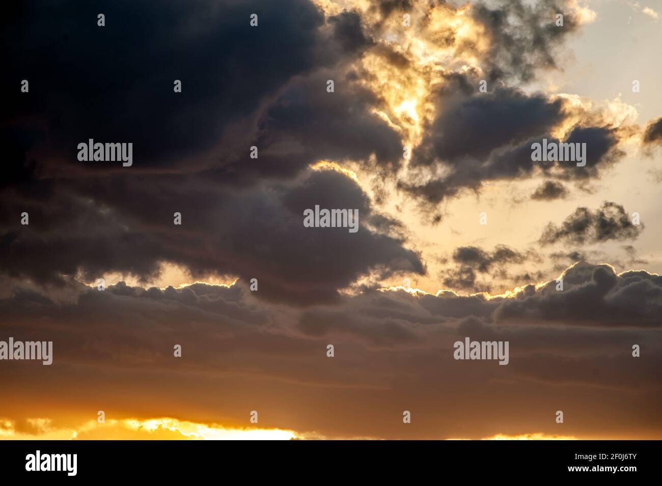 Dynamic sky with dark clouds on sunset Stock Photo - Alamy