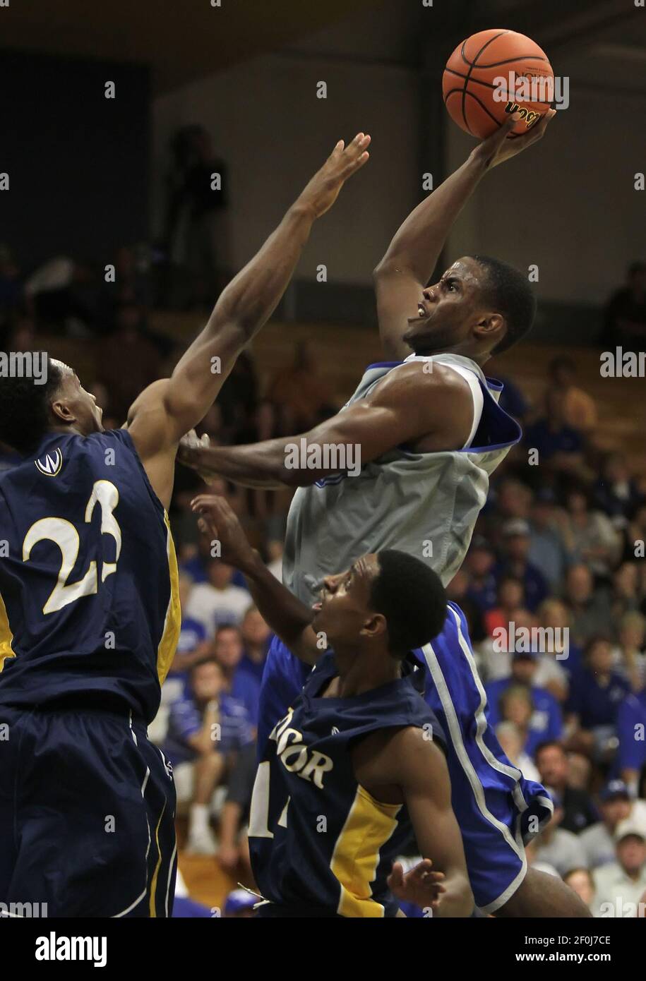Darius Miller of Kentucky takes a shot over the University of Windsor ...