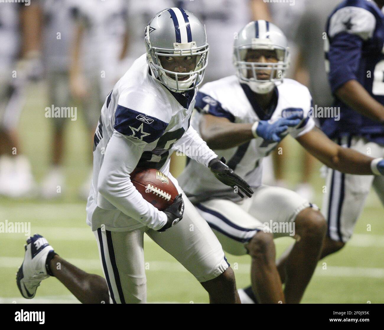 The Dallas Cowboys' Kevin Ogletree looks upfield after a pass reception ...