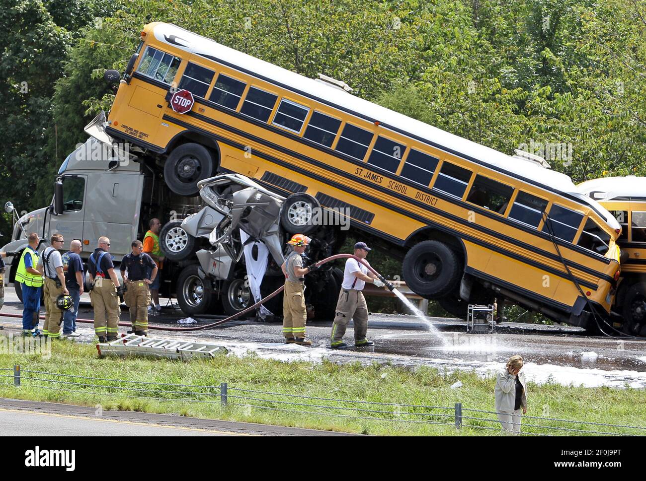 Emergency crews clean up the accident involving two school buses ...