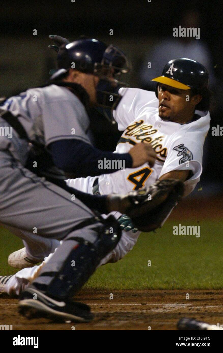Oakland Athletics' Coco Crisp (4) scores past Tampa Bay Rays catcher ...