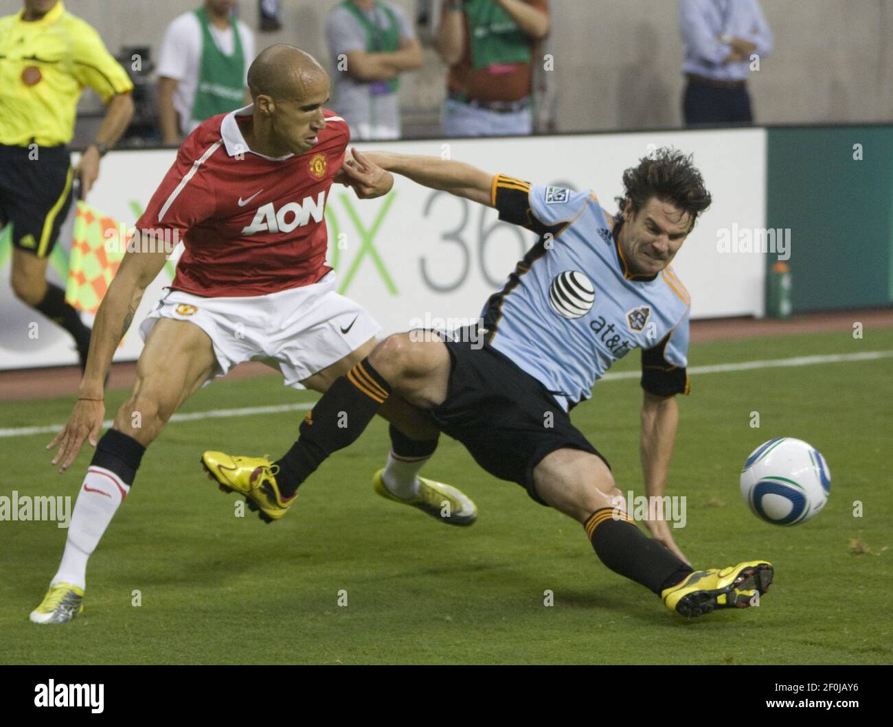 Heath Pearce of the MLS All-Stars, right, battles Gabriel Obertan of ...