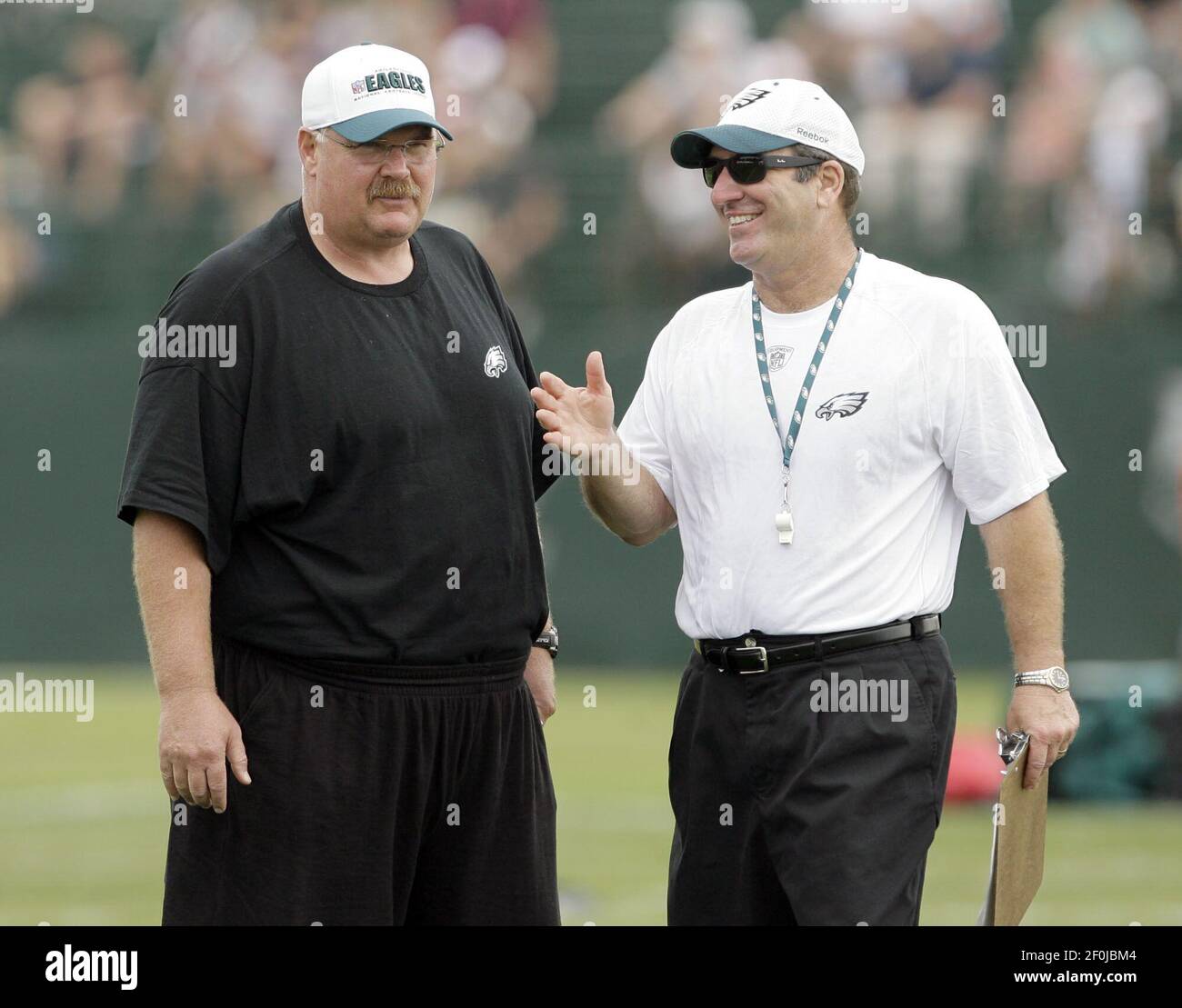 Philadelphia Eagles head coach Andy Reid, left, listens to special ...