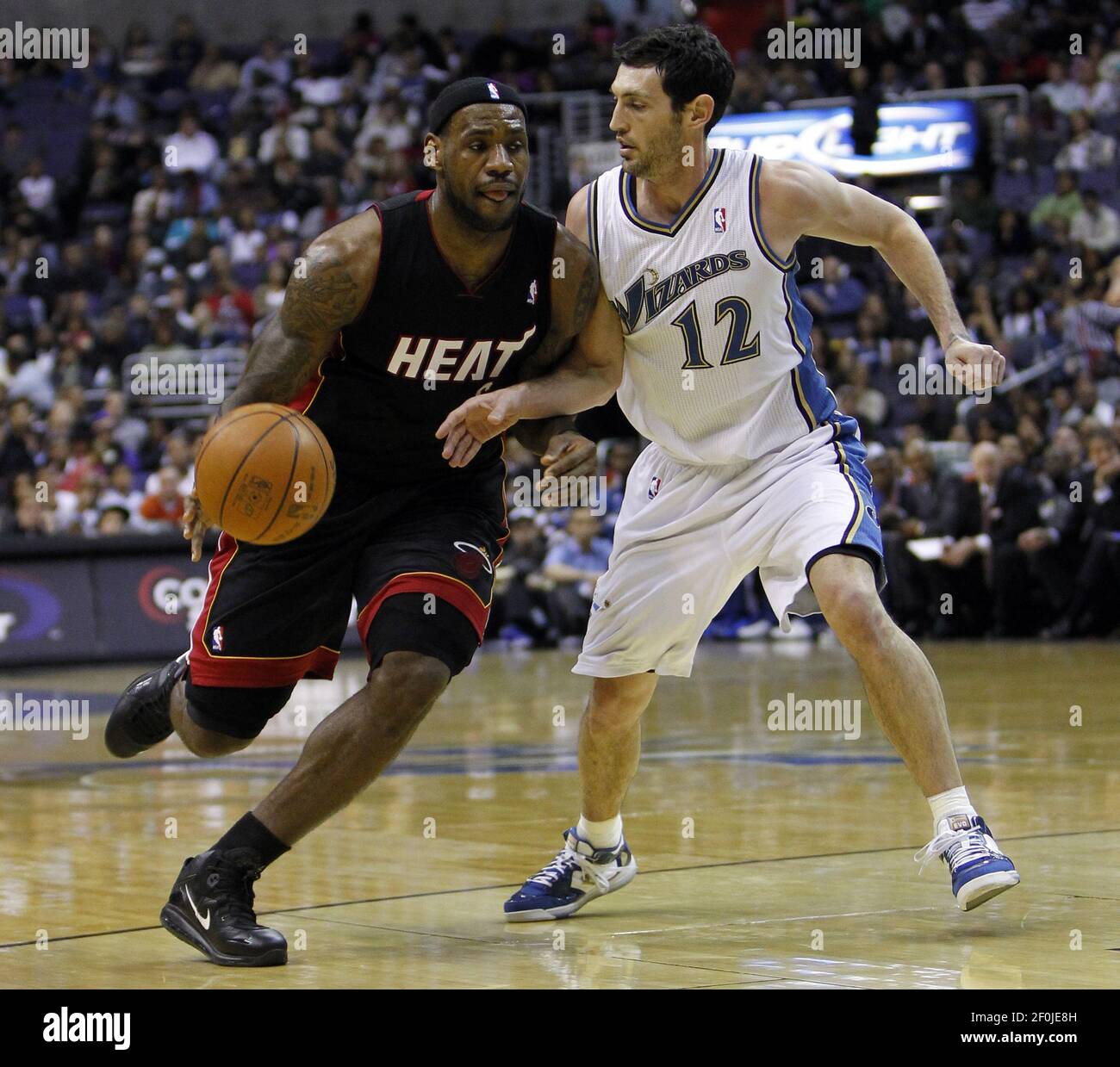 Miami Heat forward LeBron James, left, drives on Washington Wizards ...