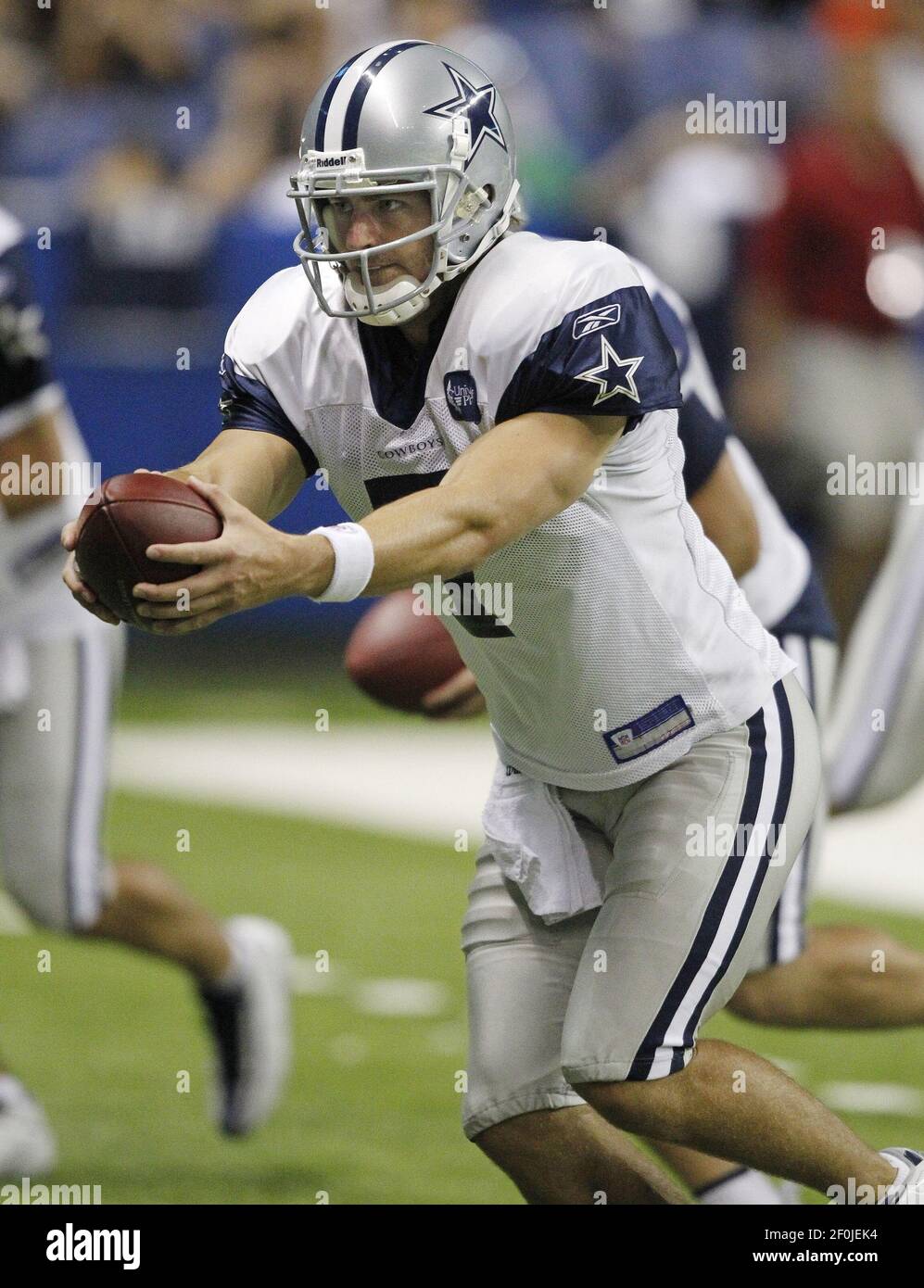 Quarterback Stephen McGee hands off during drills at the Dallas Cowboys ...