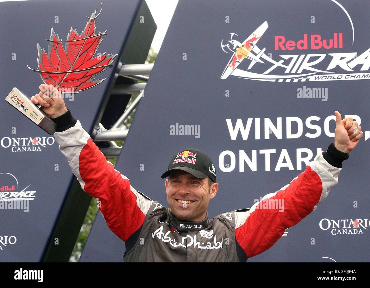 Red Bull Air Race winner Hannes Arch of Austria raises his arms in ...