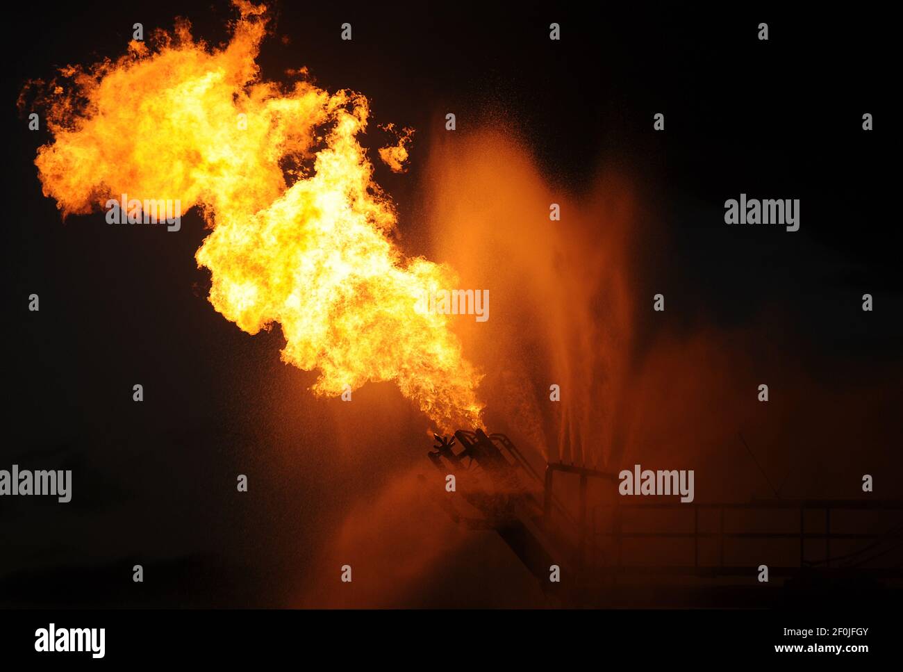Gas from the damaged Deepwater Horizon wellhead is burned by the ...