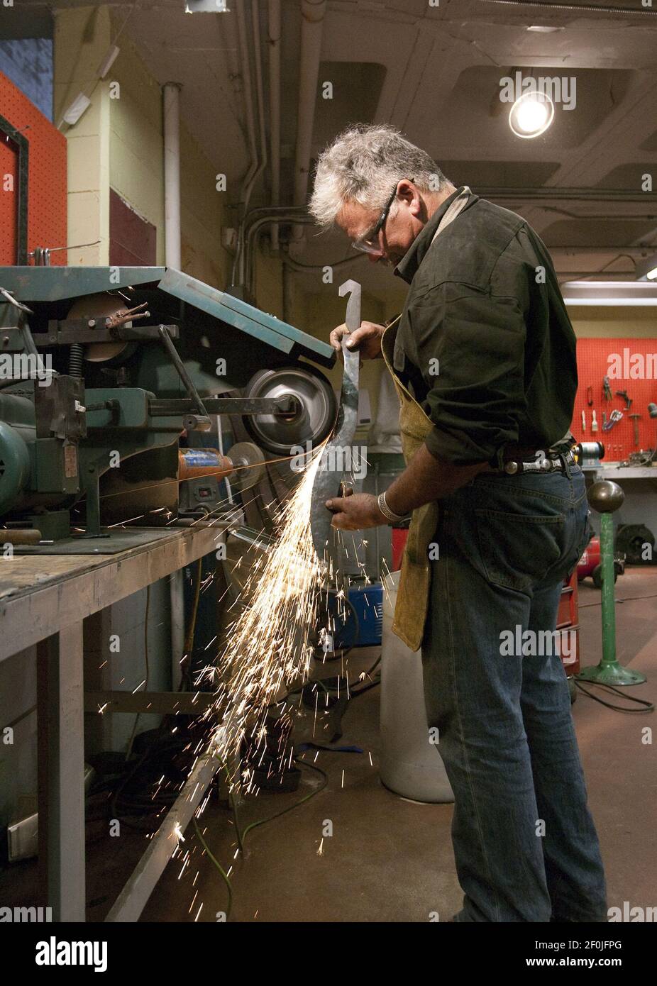 Chief weapons builder Dave Baker demonstrates how they created a blade ...