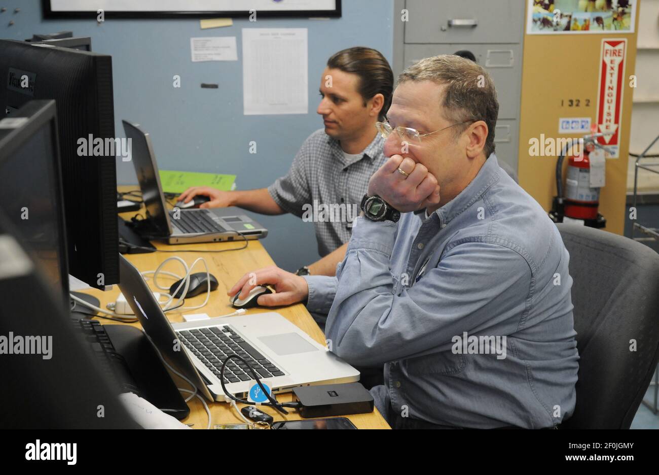 (from right) Dr. Larry A. Mayer, professor and director of the center ...