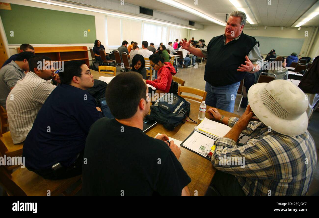 Fresno State University assistant professor Lloyd Crask talks to one of ...