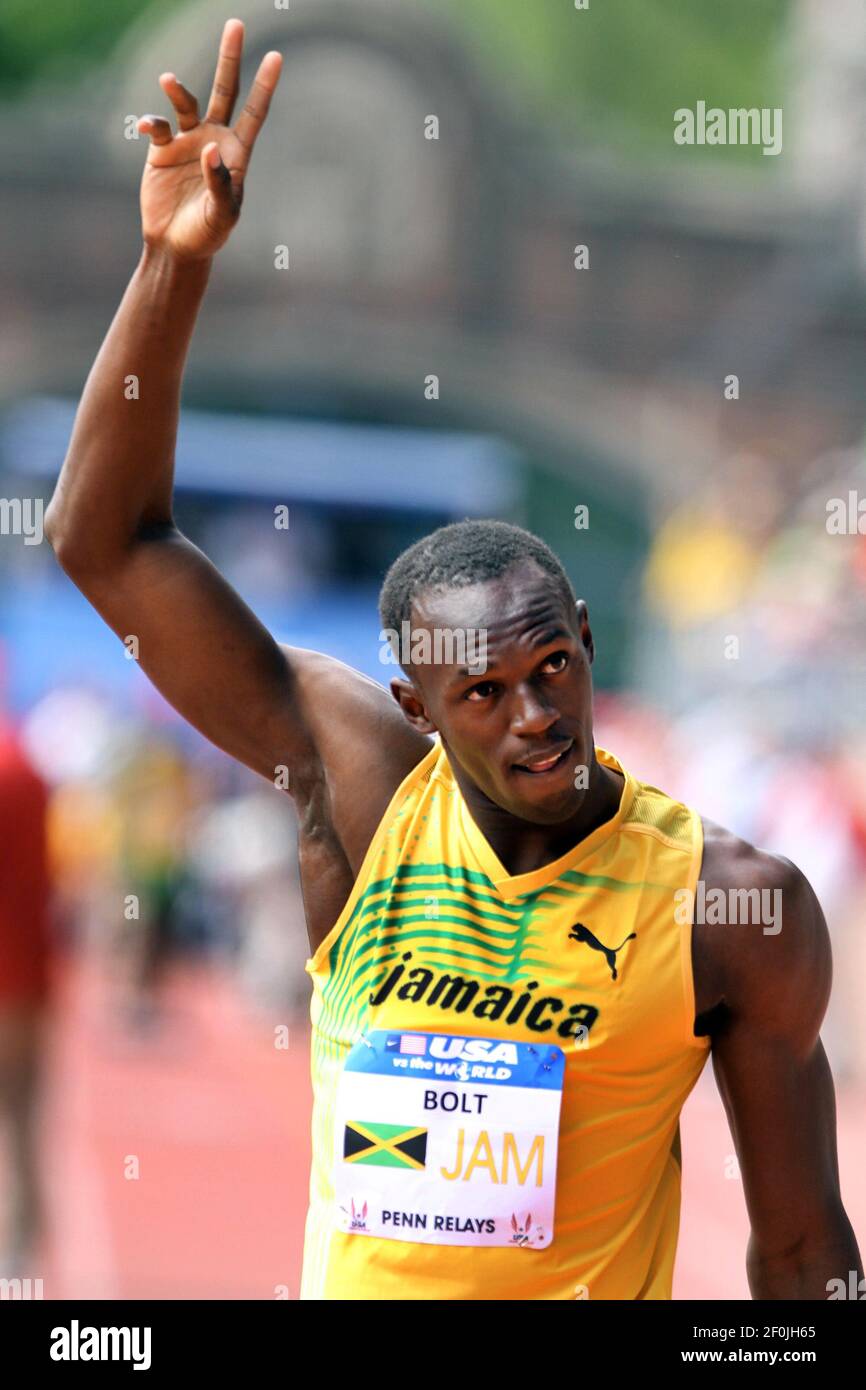 Jamaican runner Usain Bolt waves to fans as he takes the field for the ...