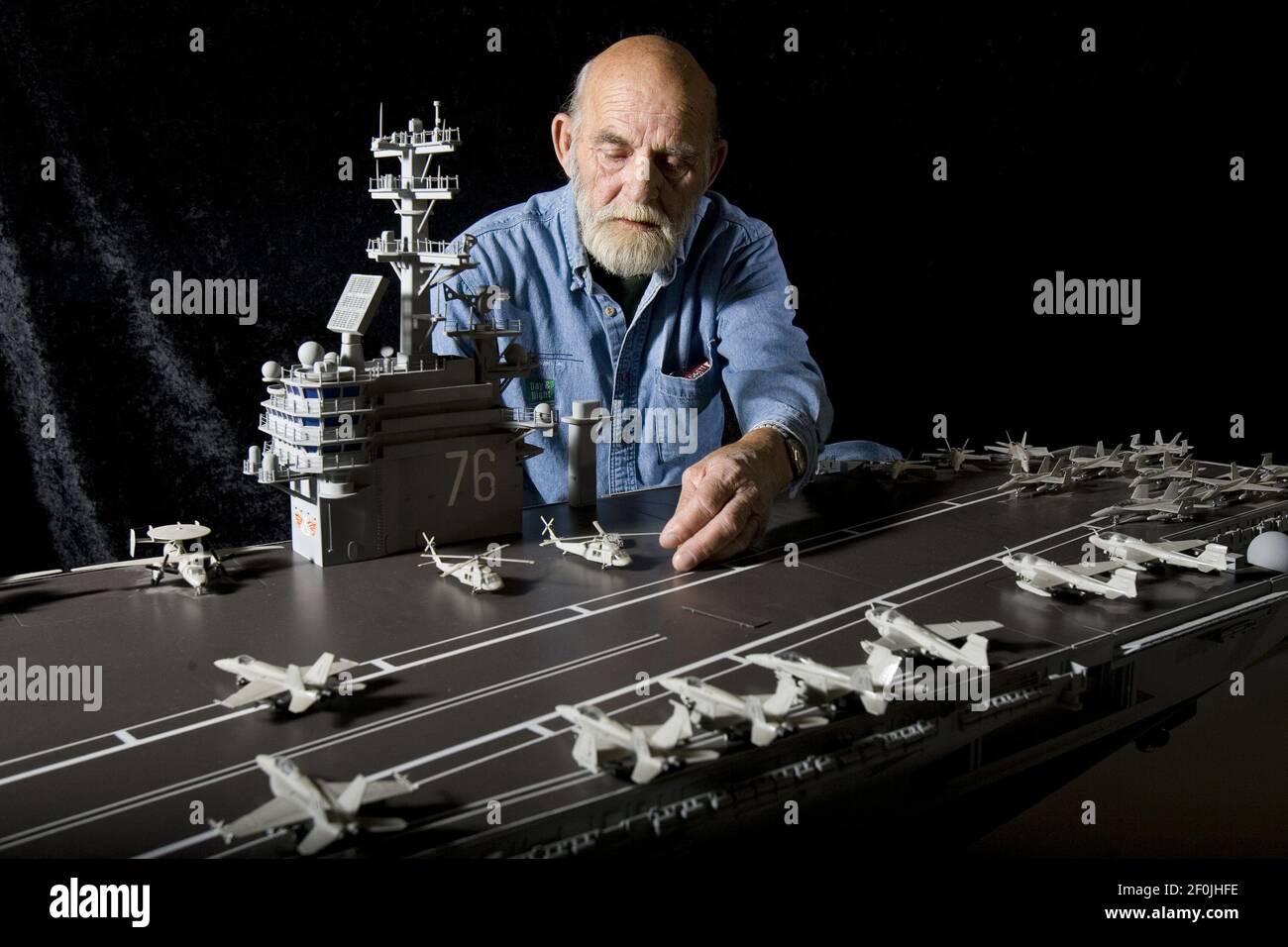 Ray Conley shows the model of the USS Ronald Reagan he created from ...