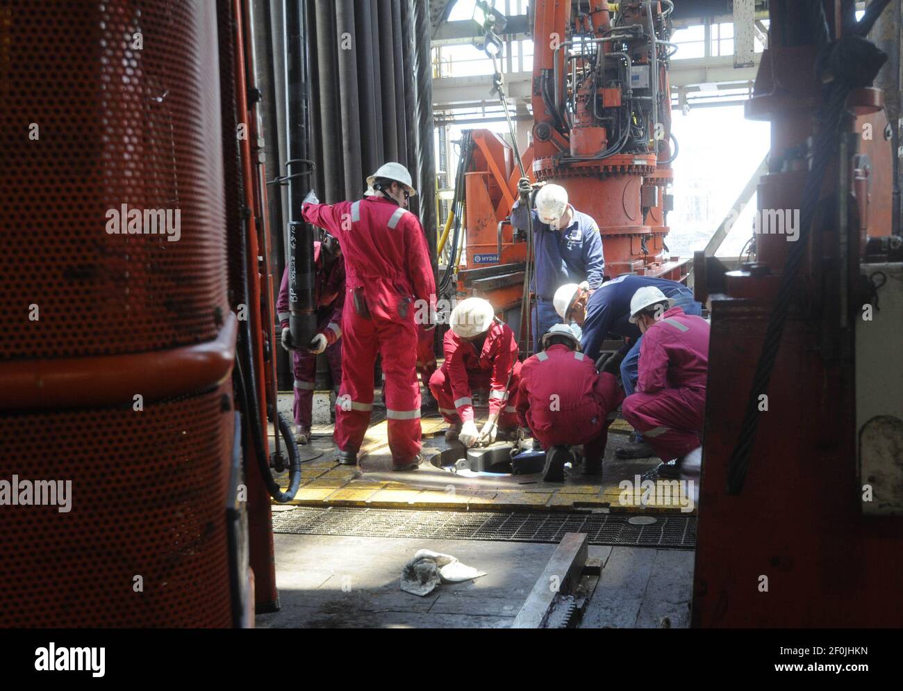 Workmen are tripping in the well bore on Saturday, June 19, 2010, as ...