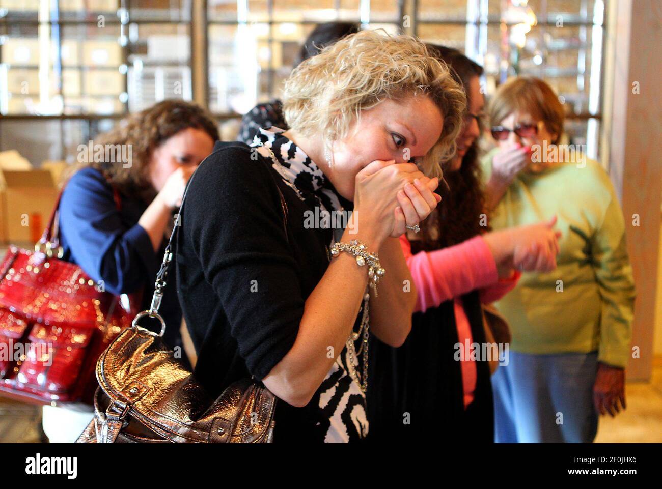 Dana Hunt, foreground, takes a whiff of a roasted bean used to make ...