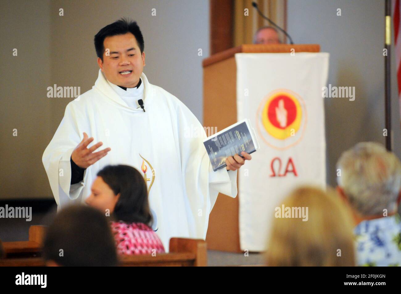Rev. Mike Tran speaks to parishioners about the recent oil spill at Our ...