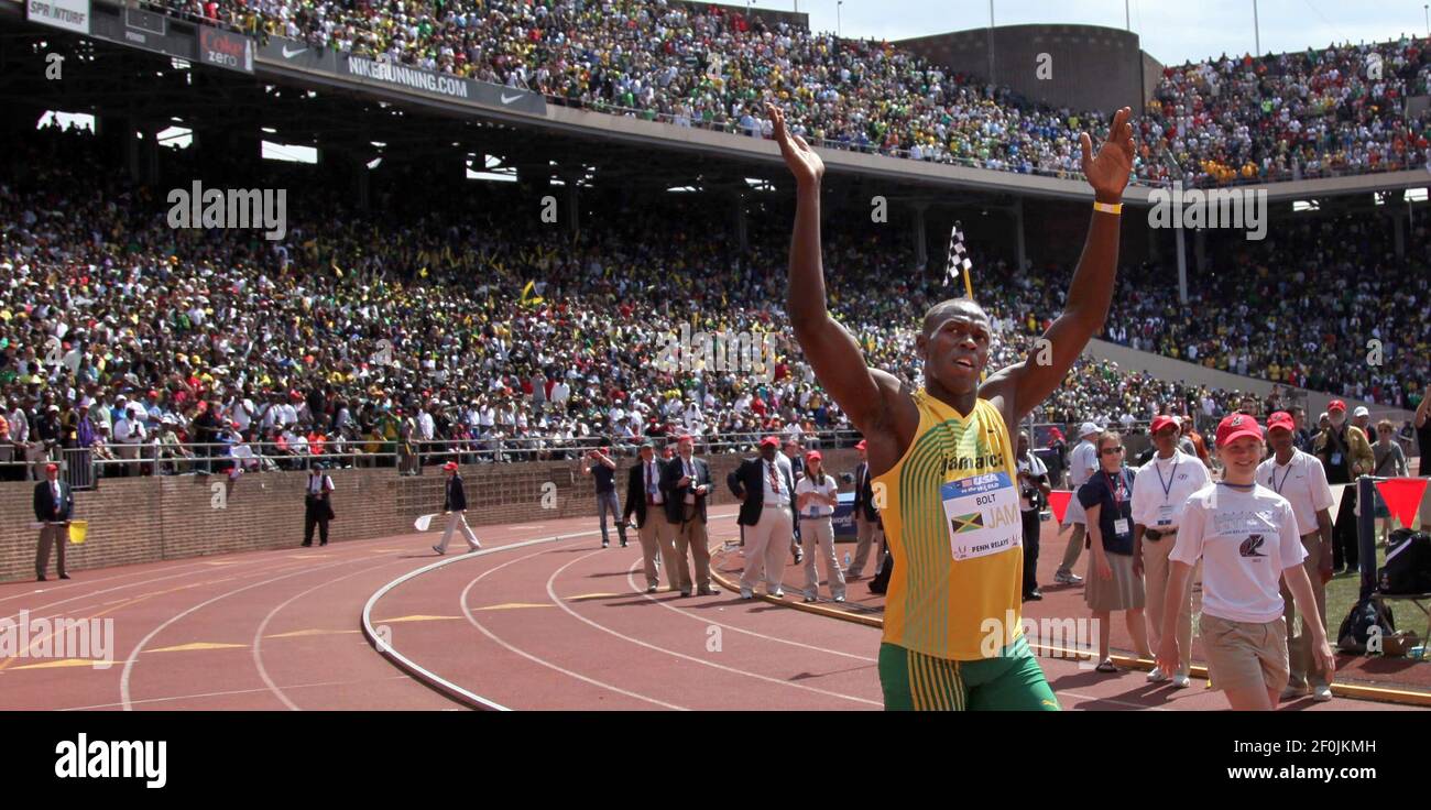 Jamaican runner Usain Bolt waves to fans after running the 4x100-meter ...