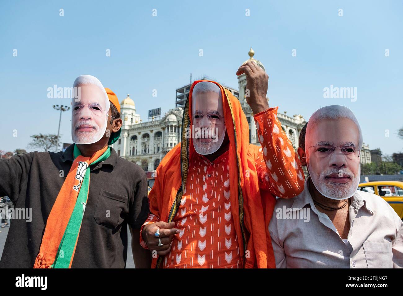 BJP supporters wearing masks of Narendra Modi take part during a mass ...